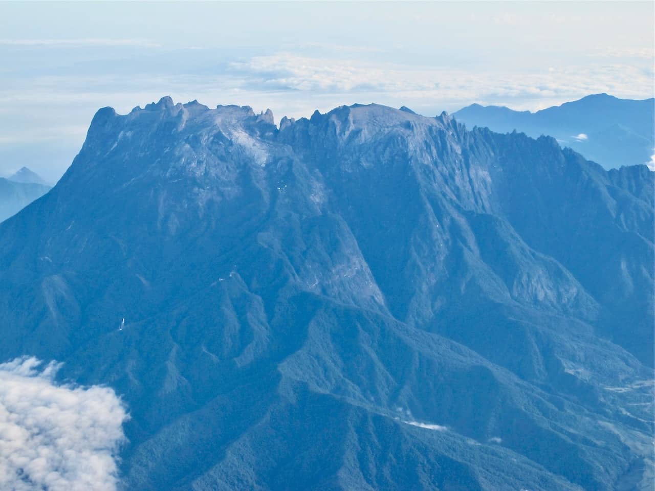 Aerial view of Mount Kinabalu from a plane window | Velvet Escape