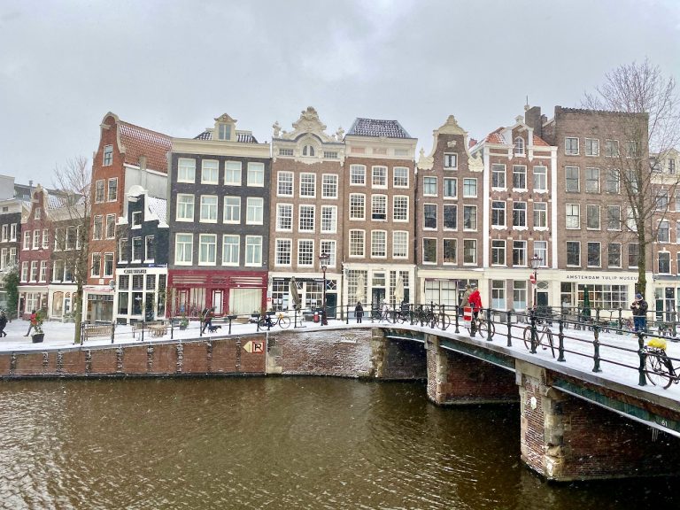 Snow and frozen canals in Amsterdam - Winter 2021 | Velvet Escape