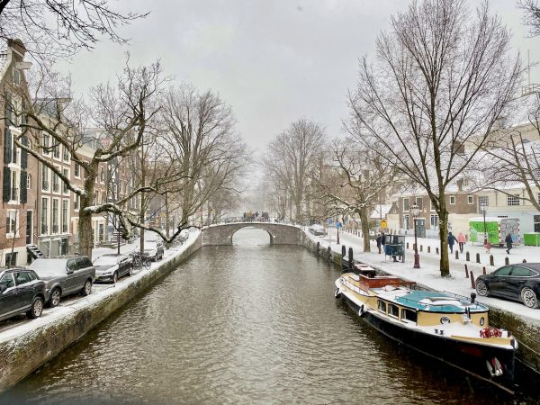 Snow and frozen canals in Amsterdam - Winter 2021 | Velvet Escape